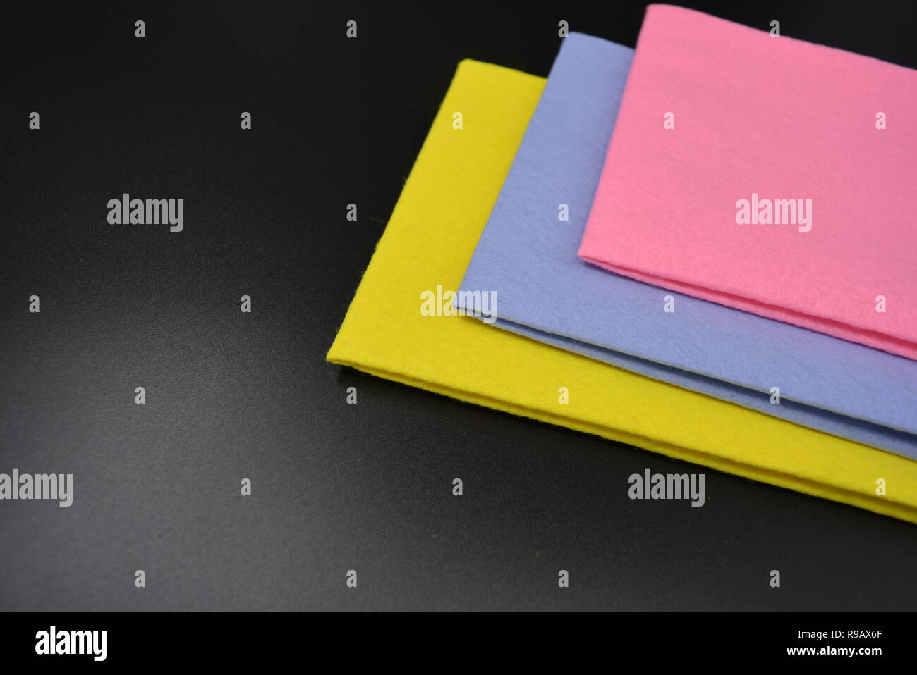 Colored new rags for dry and wet cleaning, yellow, purple and pink for ...