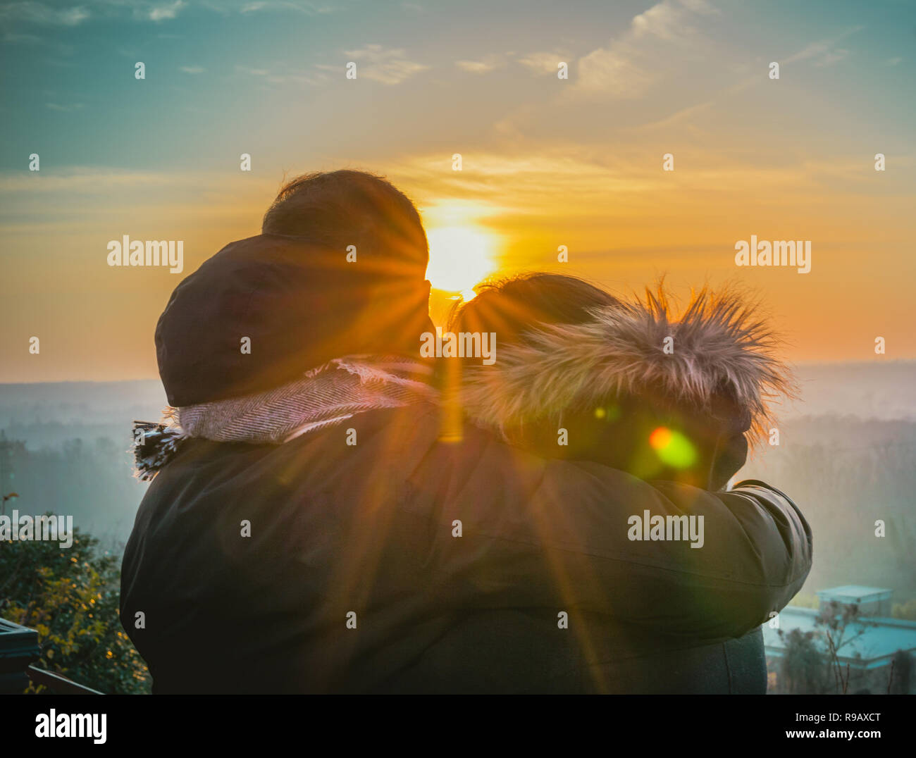 Portrait of young romantic couple in love at sunset moment Stock Photo ...