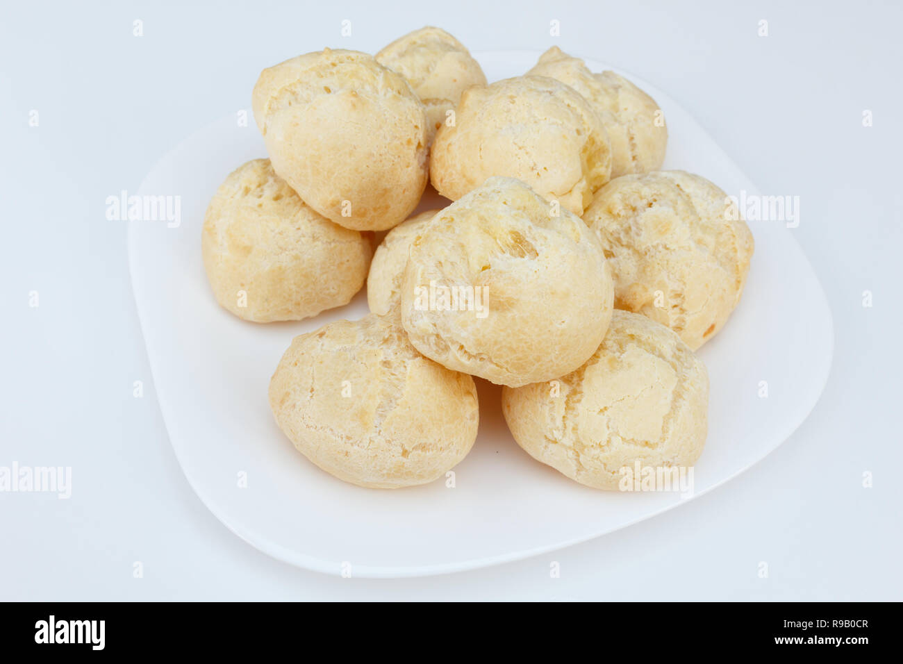 Brazilian breakfast, cheese bread (pao de queijo) served on dish on ...