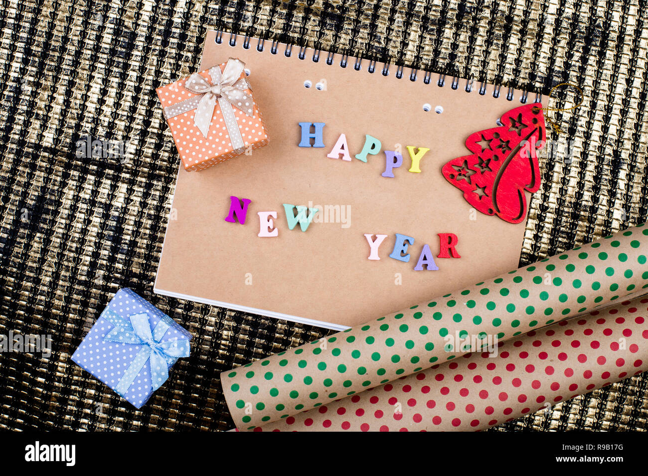 Notepad of kraft paper on a golden background with the inscription ...