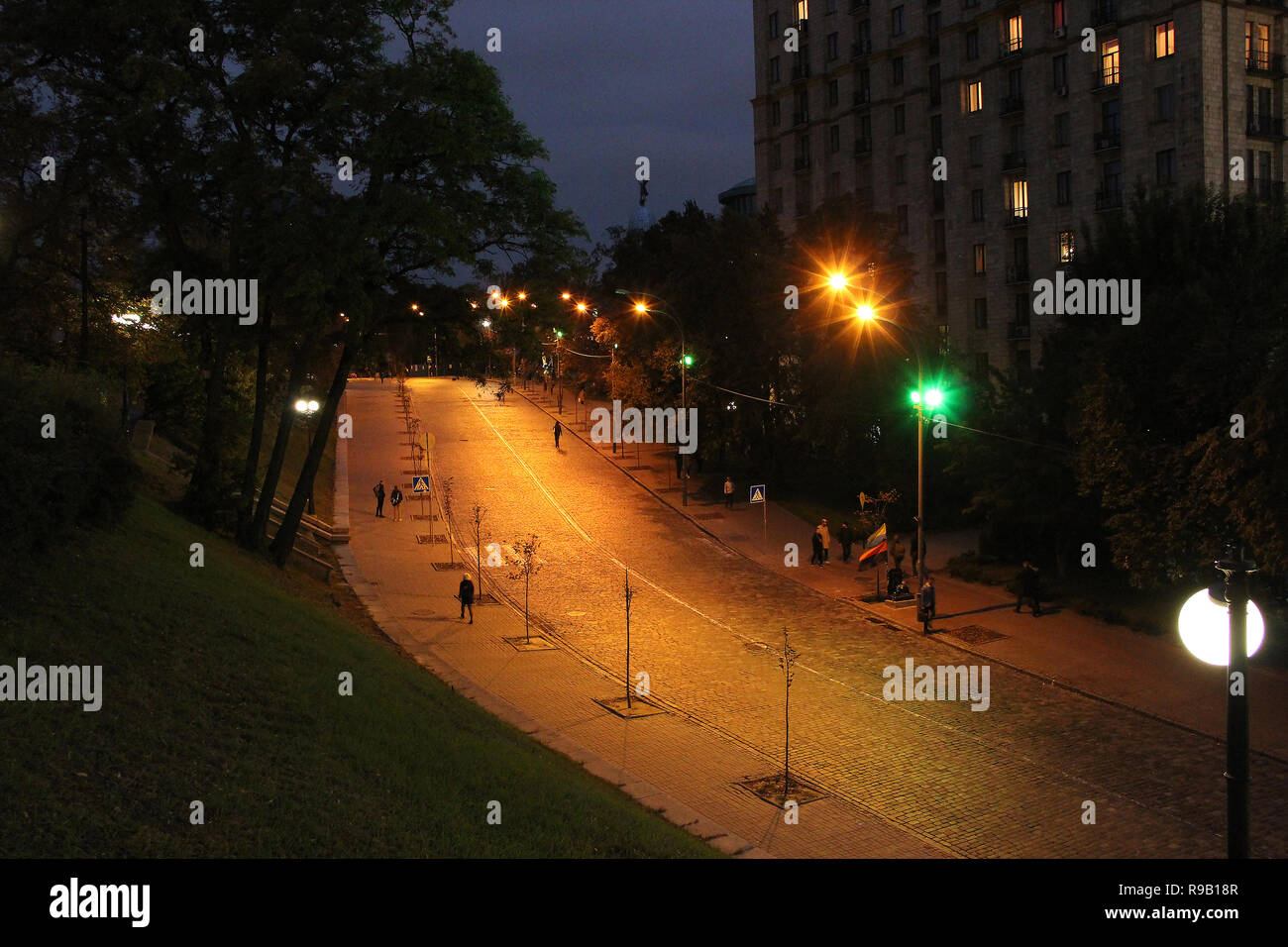 Night street with burning lanterns. Kyiv street at night. Lights of ...