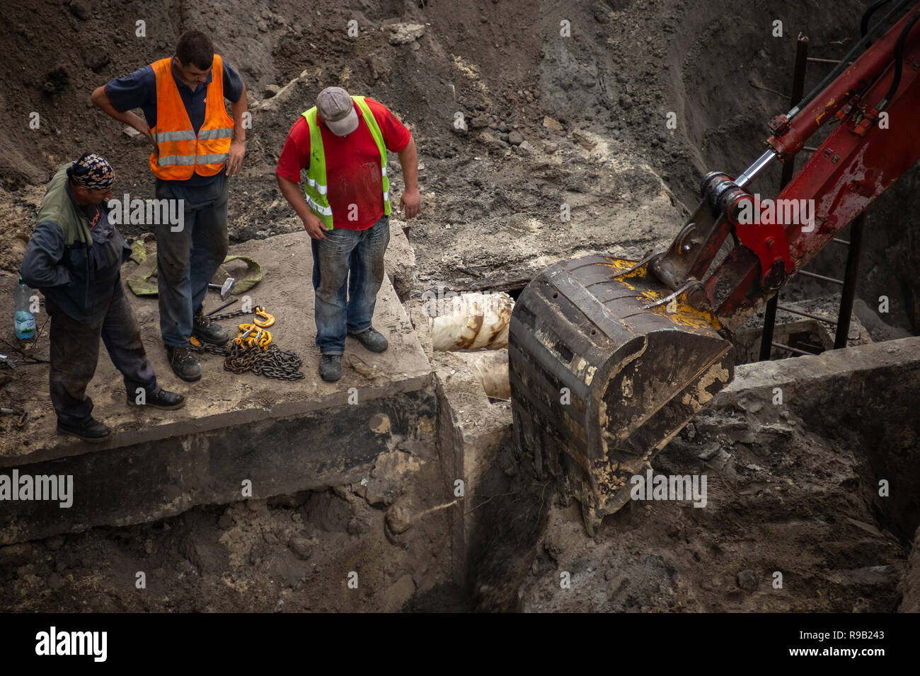Kyiv, Ukraine, September 15 , 2018. Excavator digging a pit, three ...