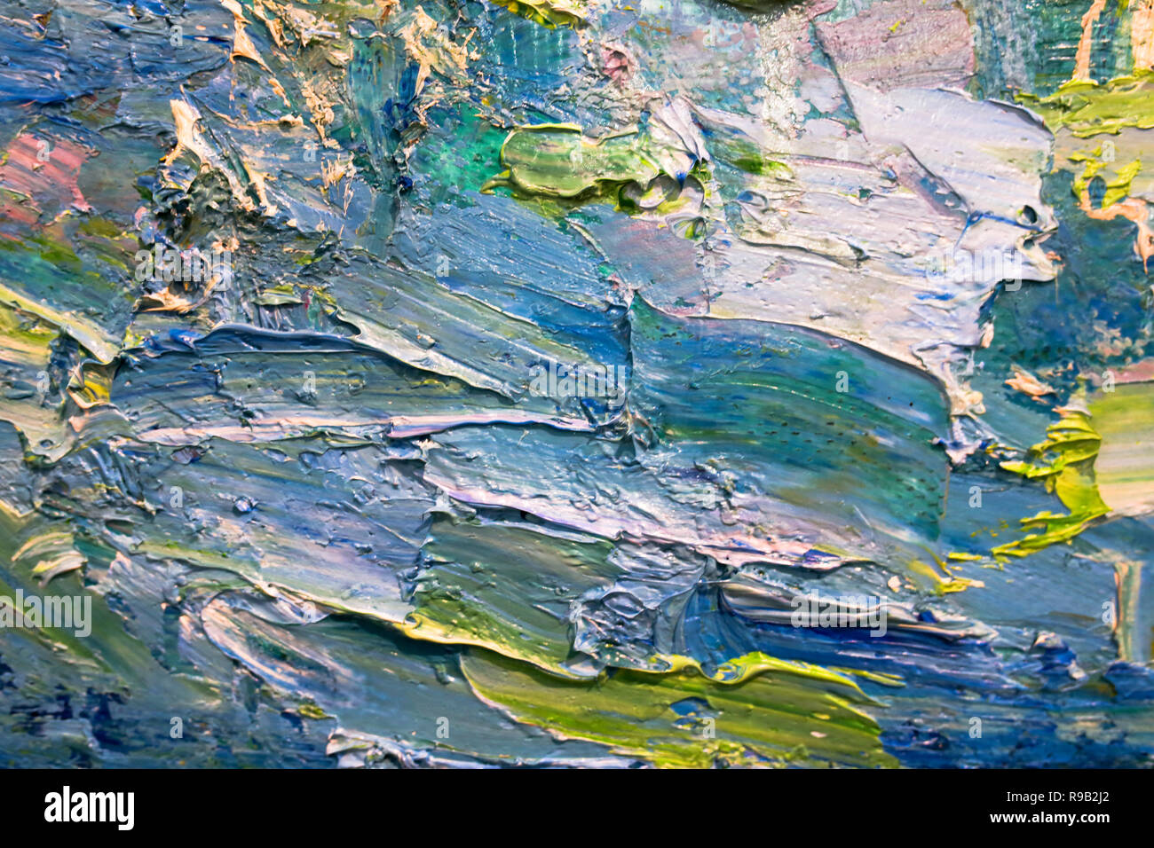 multi-colored strokes of oil paint on the artist's palette. the texture ...