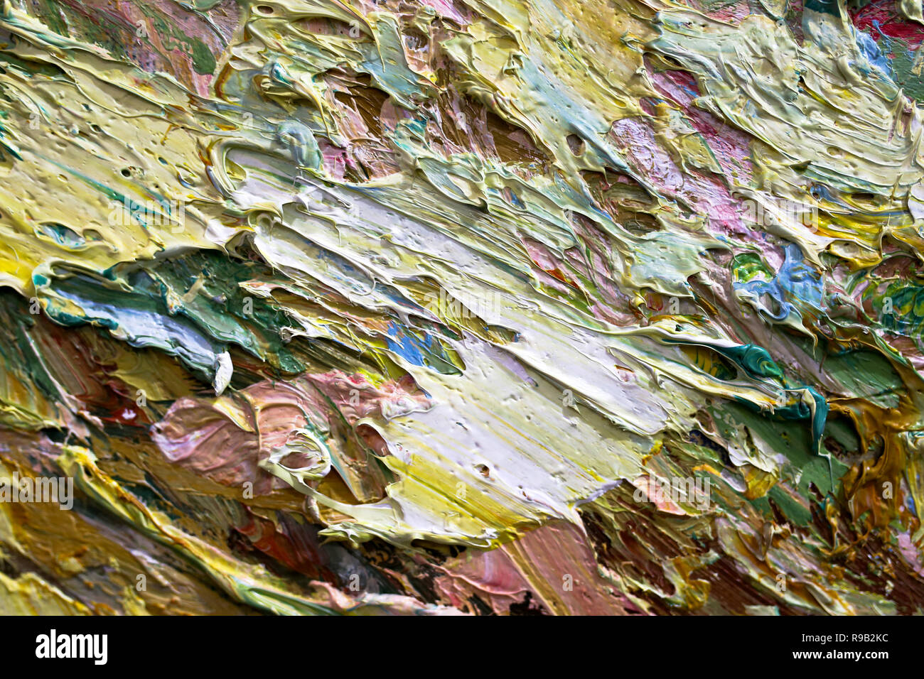 multi-colored strokes of oil paint on the artist's palette. the texture ...