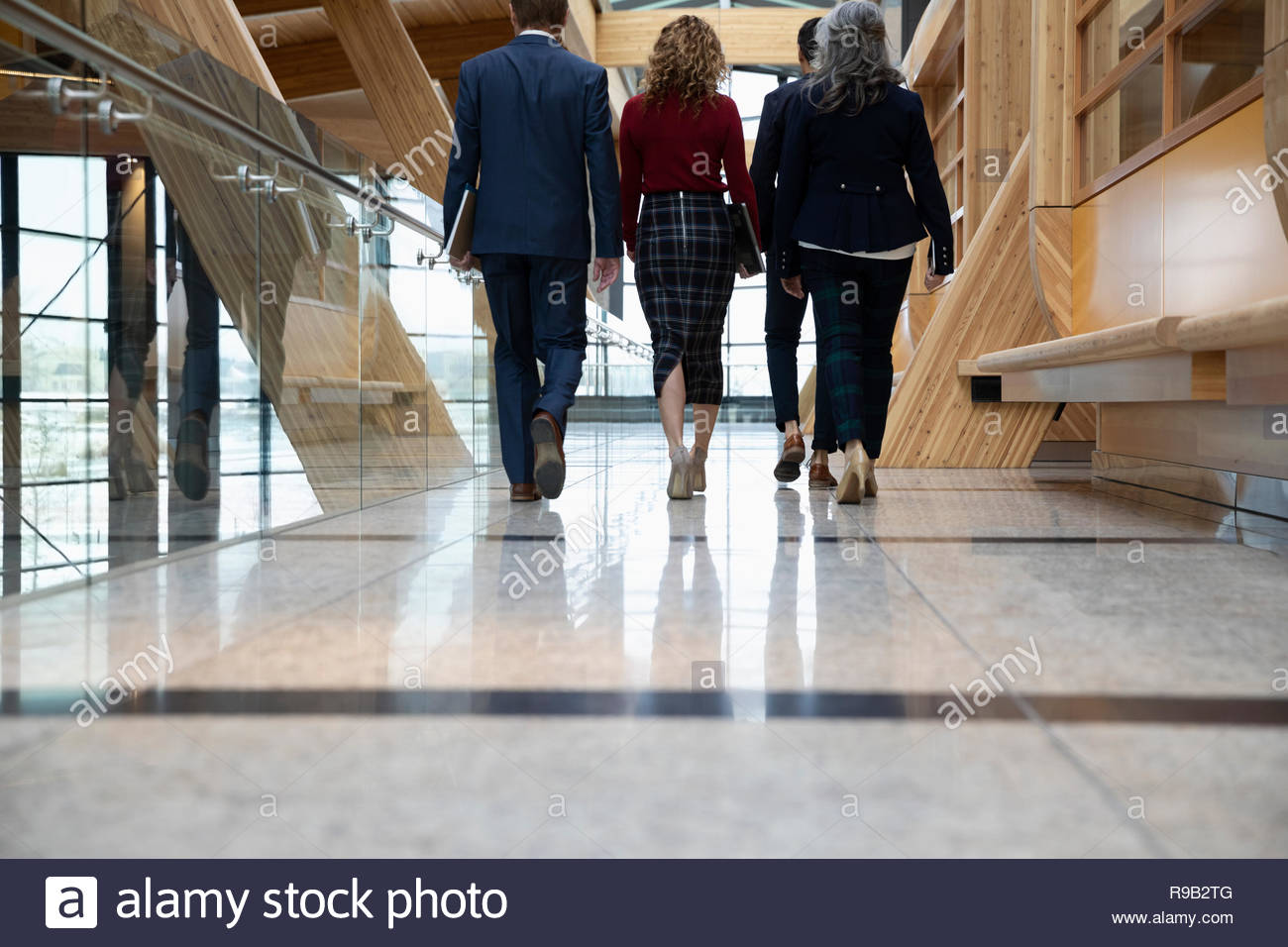 Group business people leaving office hi-res stock photography and ...