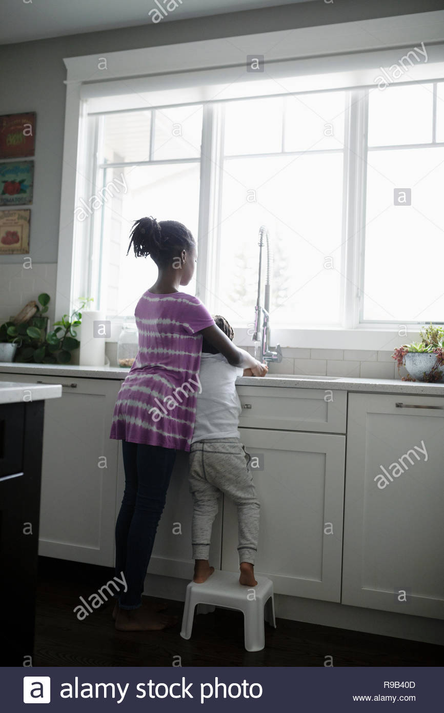 Brother washing sister hi-res stock photography and images - Alamy
