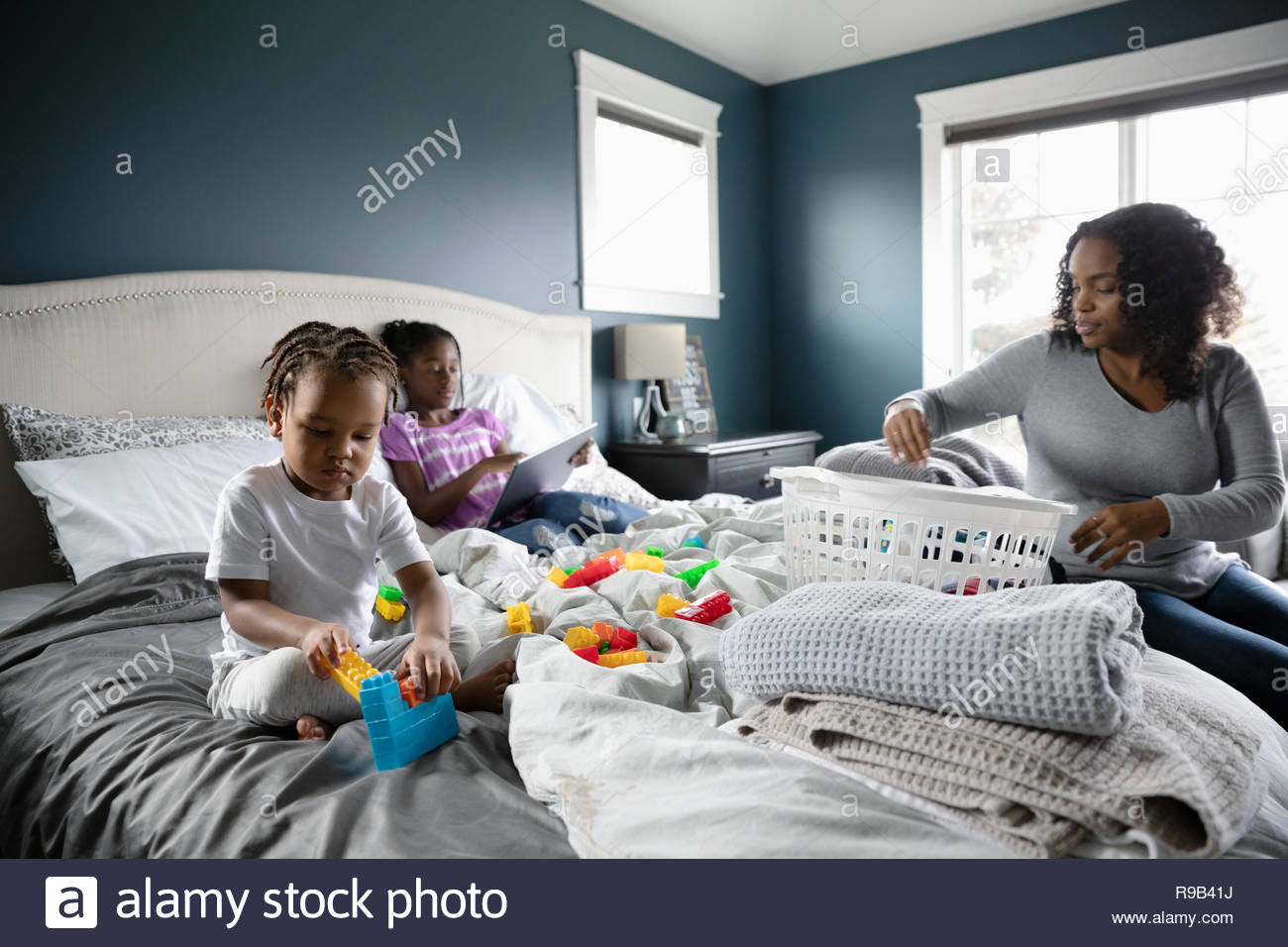 Parent and child laundry bedroom hi-res stock photography and images ...