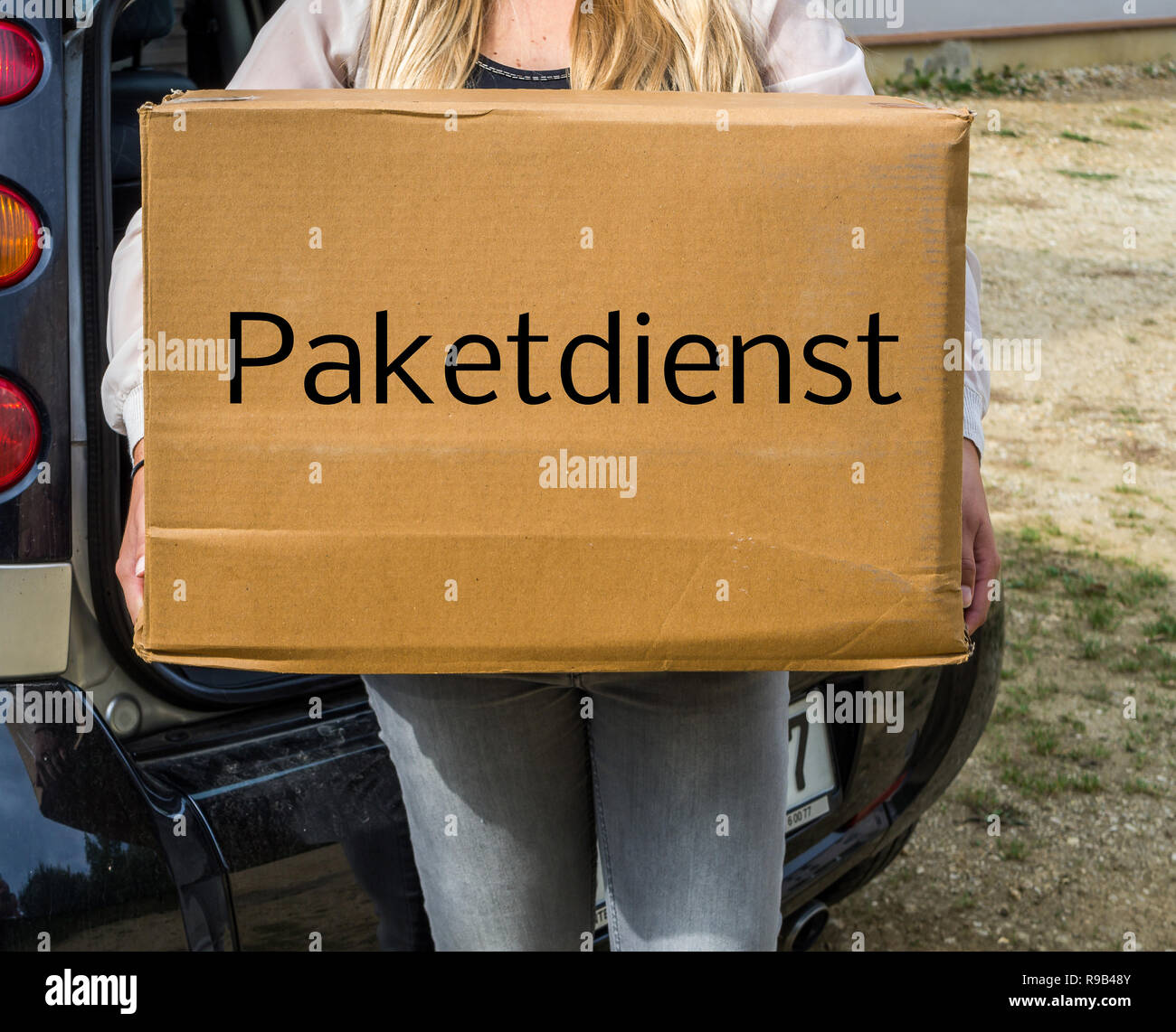 Parcel service sign Stock Photo - Alamy