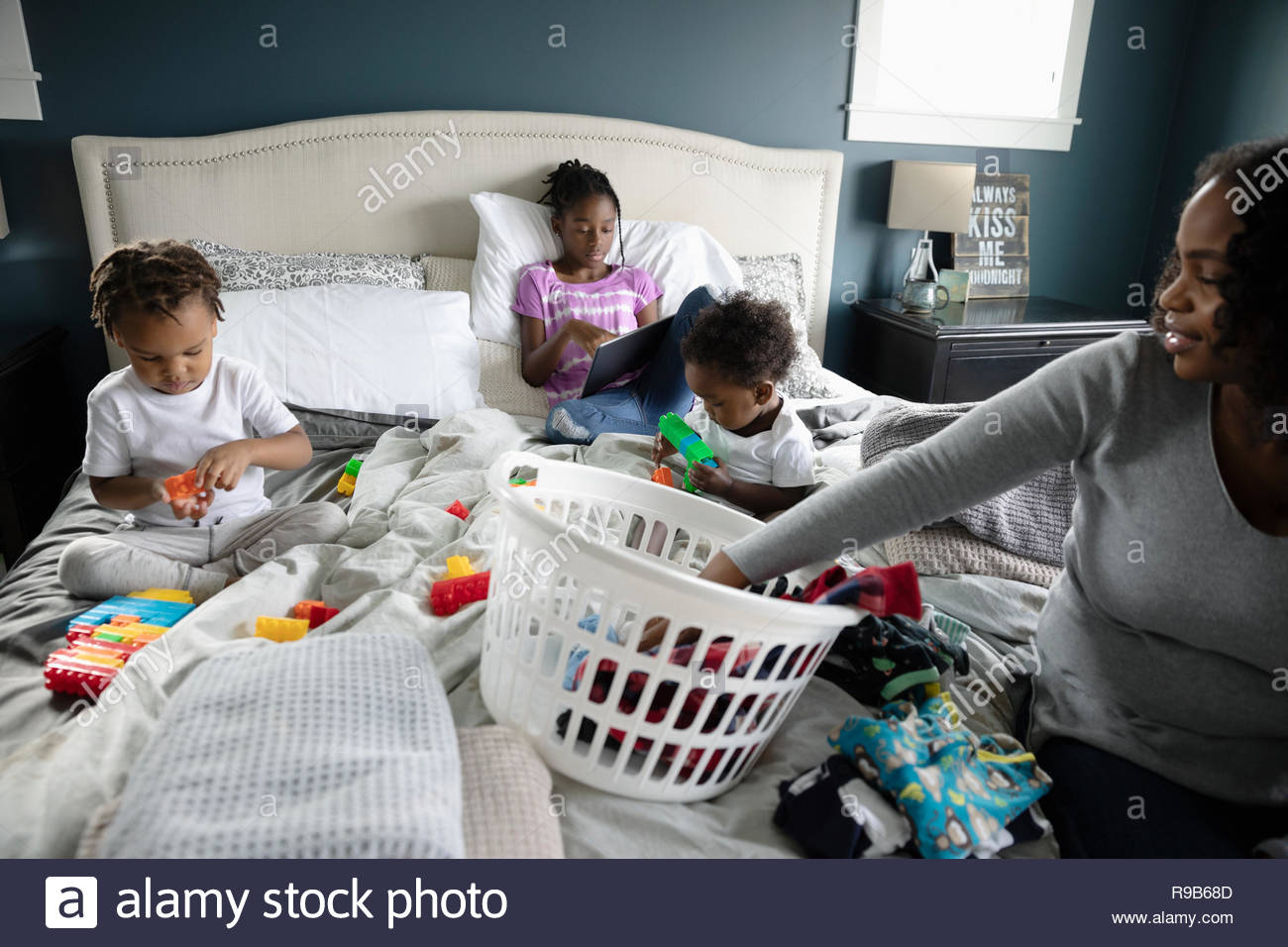 Parent and child laundry bedroom hi-res stock photography and images ...