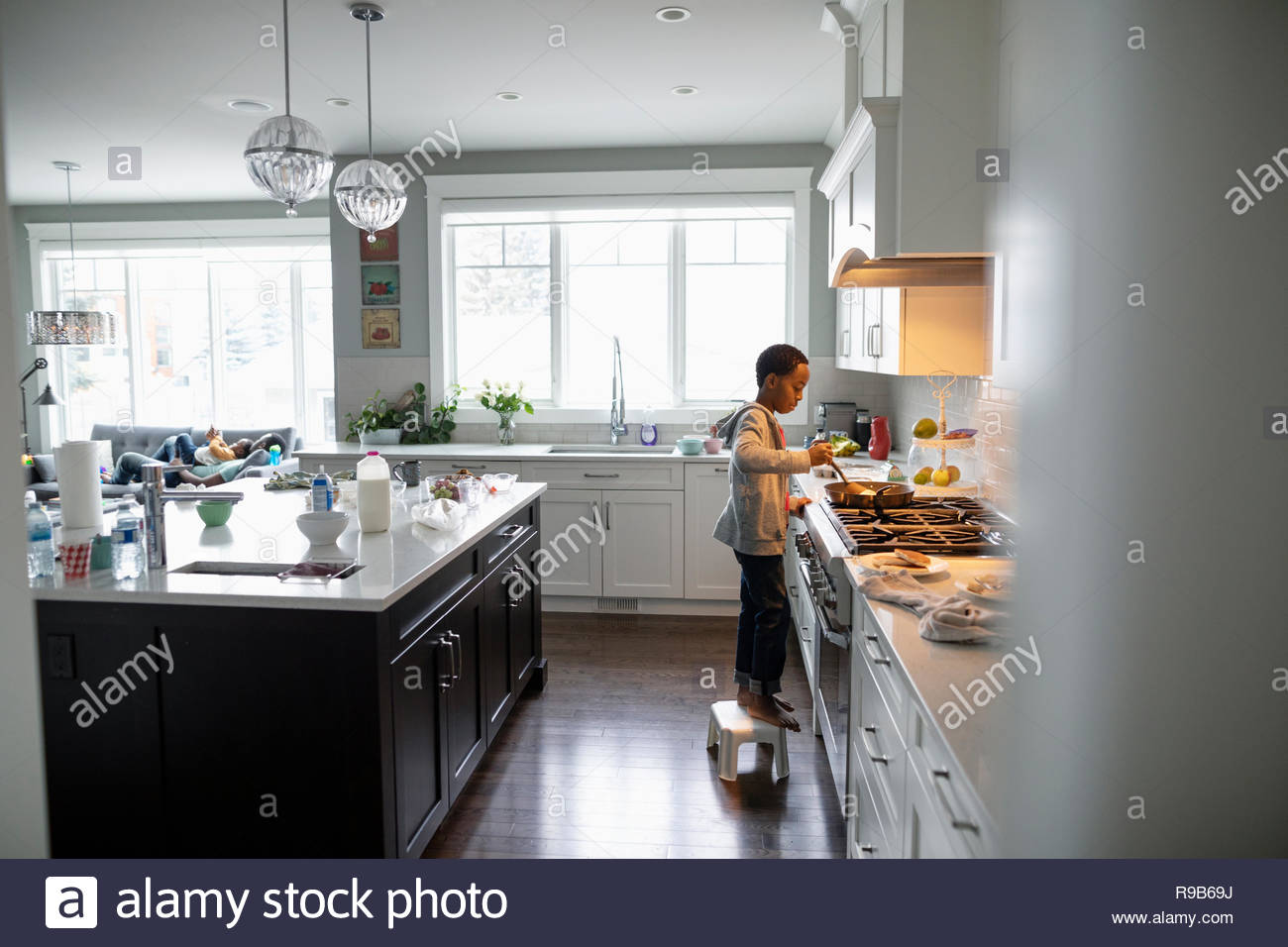 Black boys cooking hi-res stock photography and images - Alamy