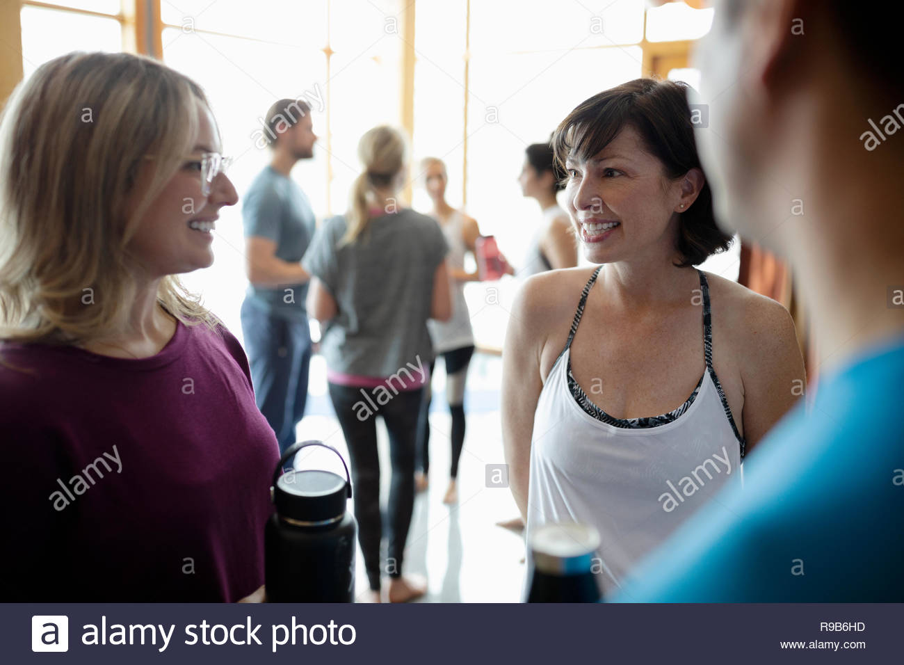 Two friends talking listening indoors hi-res stock photography and ...