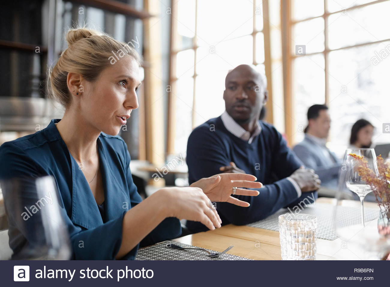 Multi ethnic people at restaurant table hi-res stock photography and ...