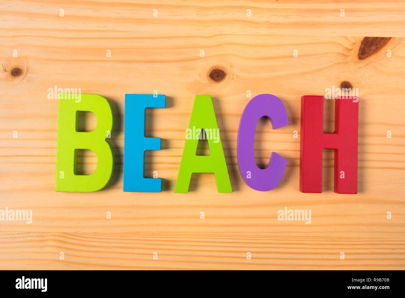Word beach in colorful hi-res stock photography and images - Alamy
