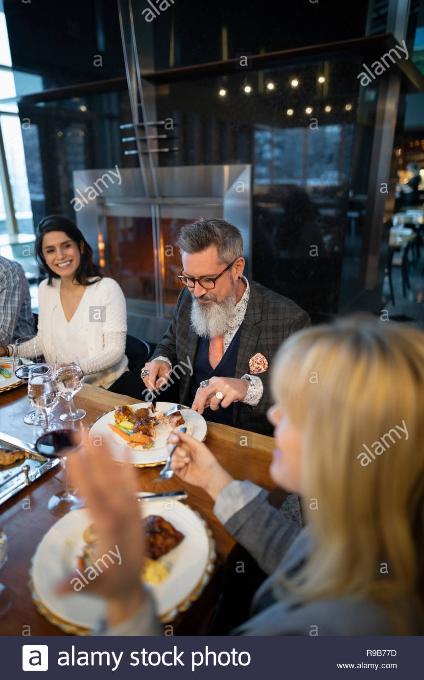 Group people sitting dining table hi-res stock photography and images ...
