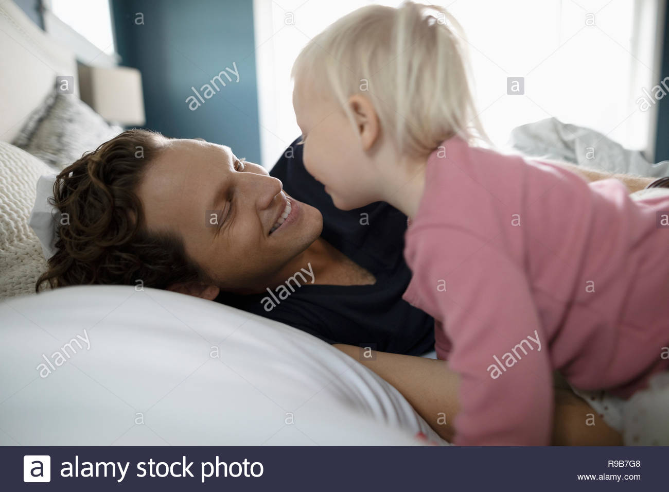Father cuddling daughter hi-res stock photography and images - Alamy