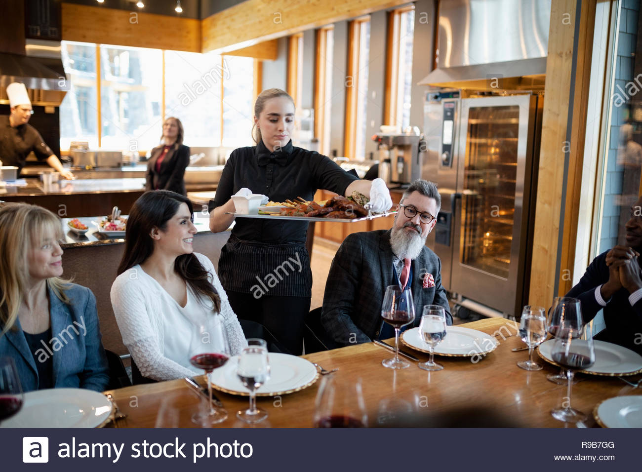 Waitress serving food restaurant hi-res stock photography and images ...