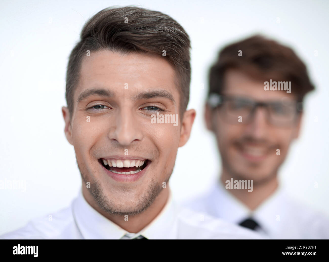 portrait two of an attractive young businessman smiling Stock Photo - Alamy