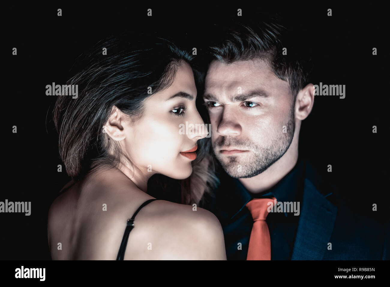 Studio portrait of a young couple Stock Photo - Alamy
