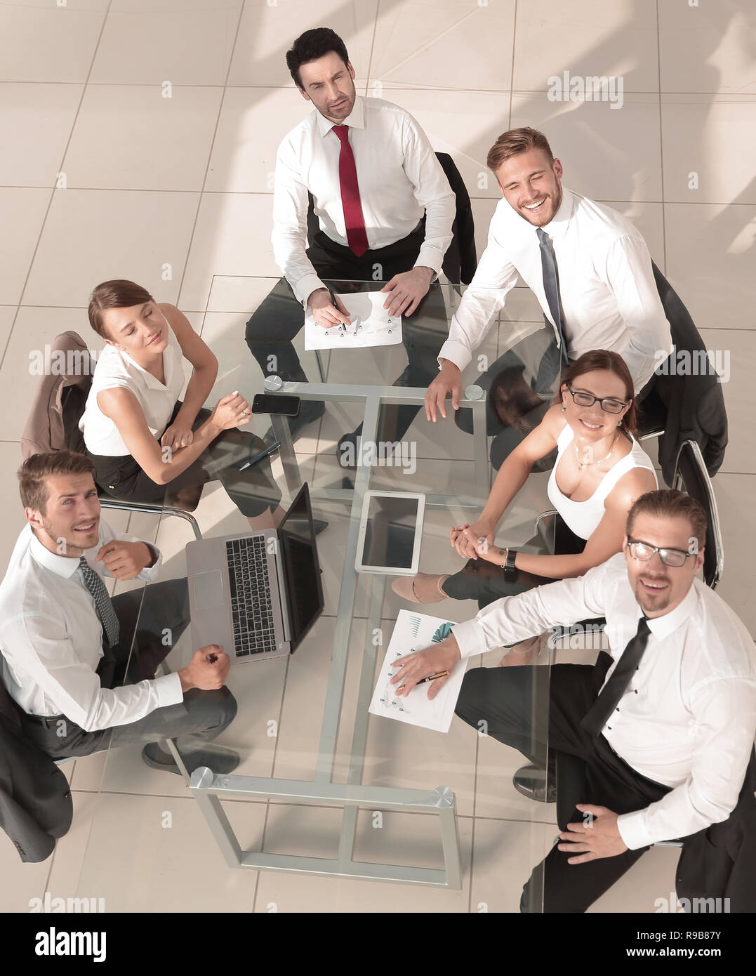 Business People Working Around a Conference Table Stock Photo - Alamy