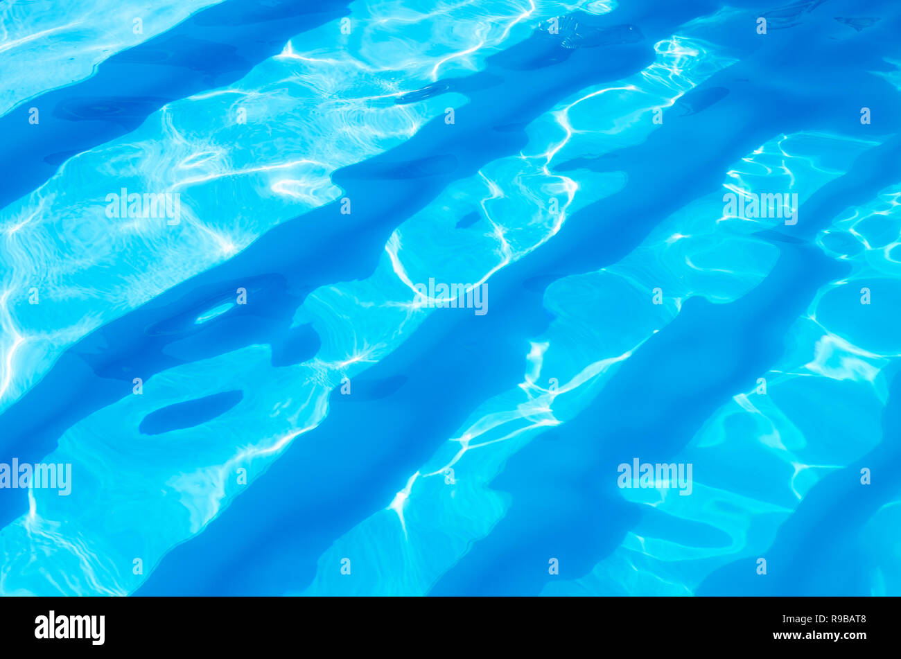 blue water background in swimming pool Stock Photo - Alamy