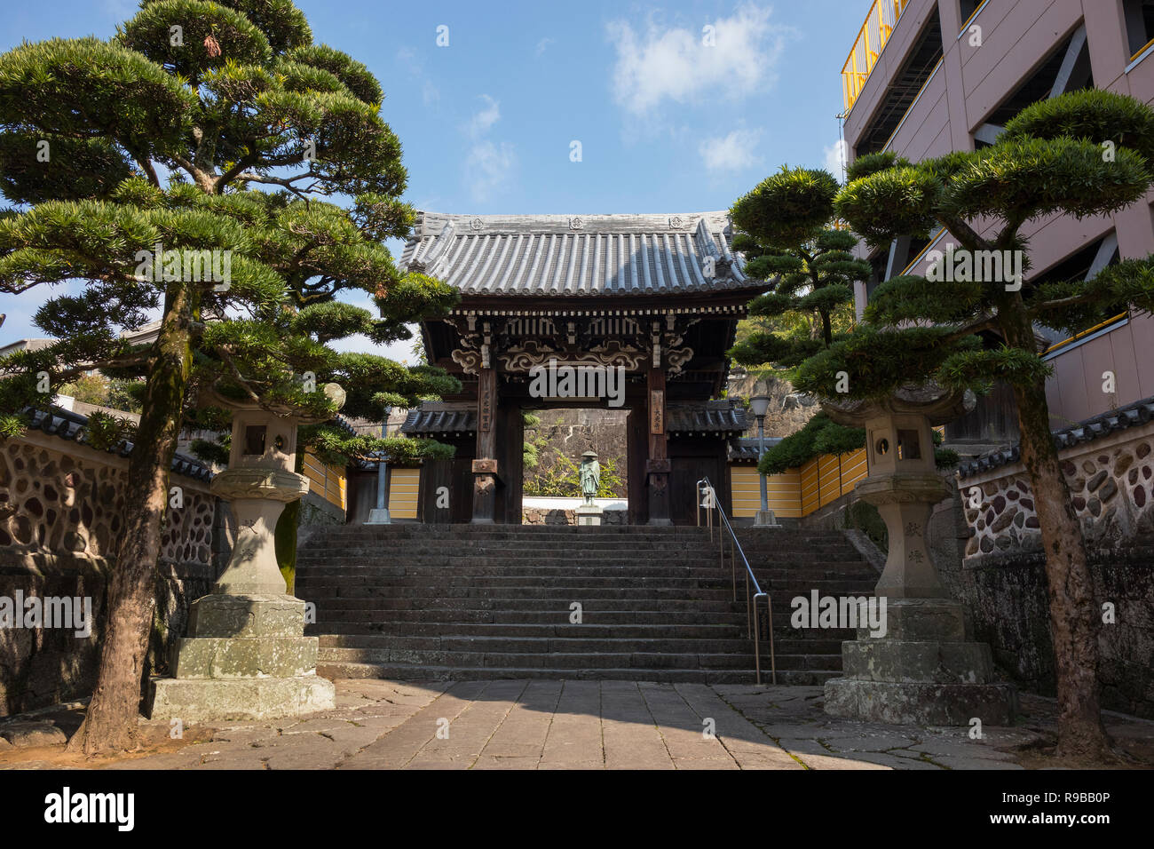 Nagasaki, Japan - October 24, 2018: Entrance gate with a priest statue ...