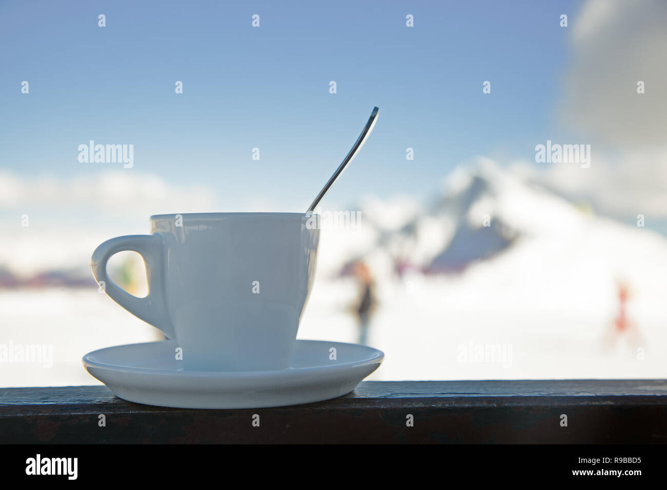 A cup of coffee on the background of snowy mountains Stock Photo - Alamy