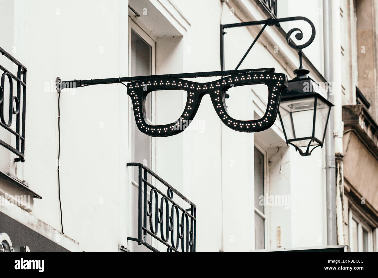 Sign board in shaped of glasses on a European street Stock Photo - Alamy