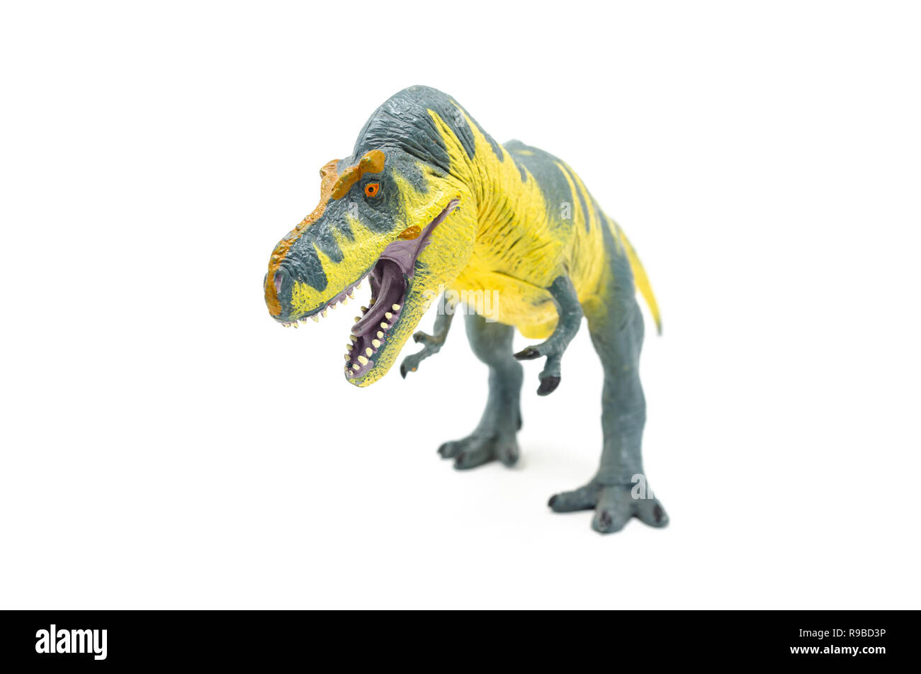 Front view of yellow blue Battat Tyrannosaurus rex dinosaur toy ...