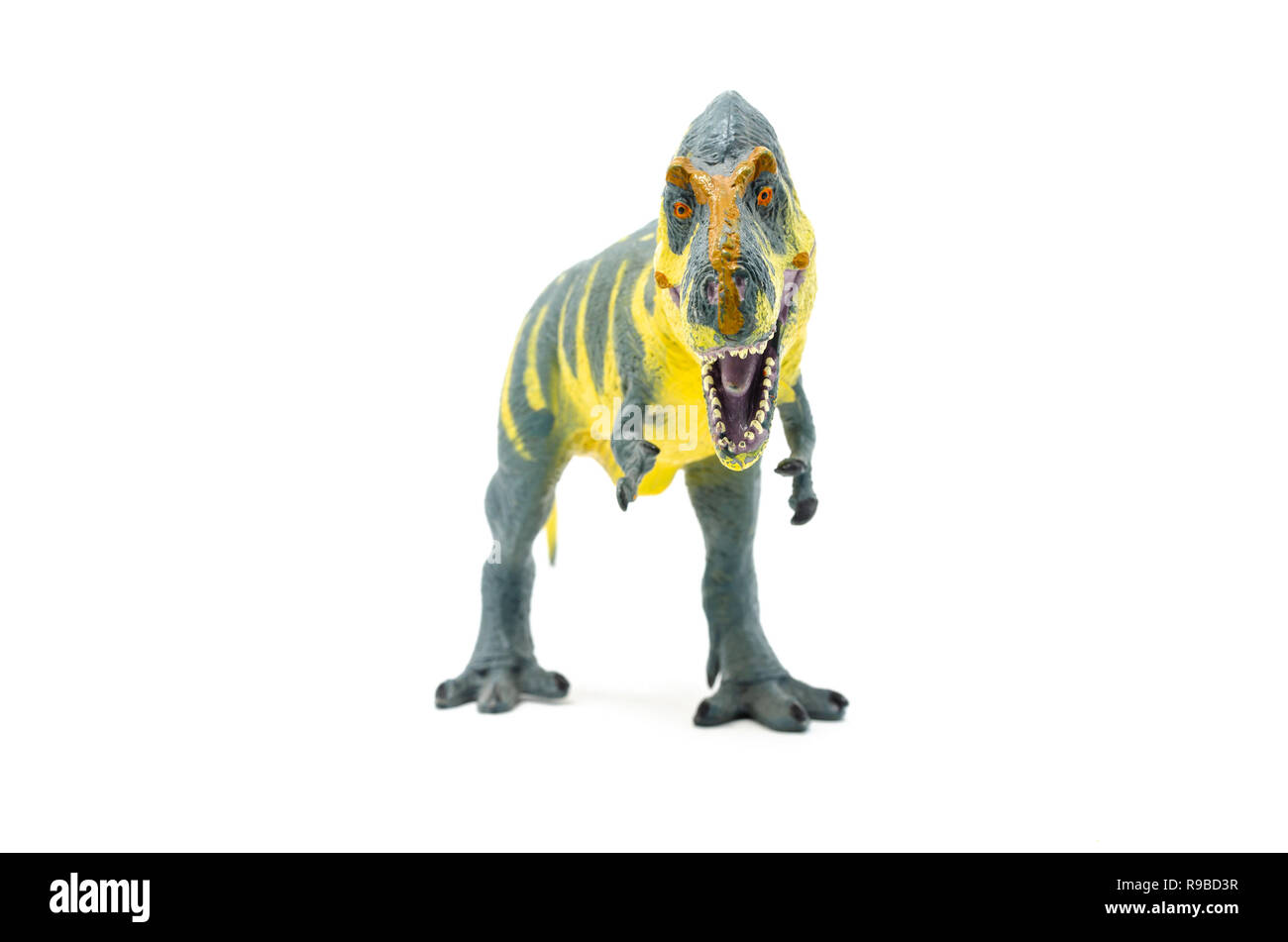 Front view of yellow blue Battat Tyrannosaurus rex dinosaur toy ...