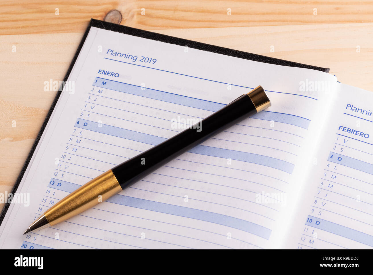 Business concept - Top view of an open notebook diary in hardcover with ...