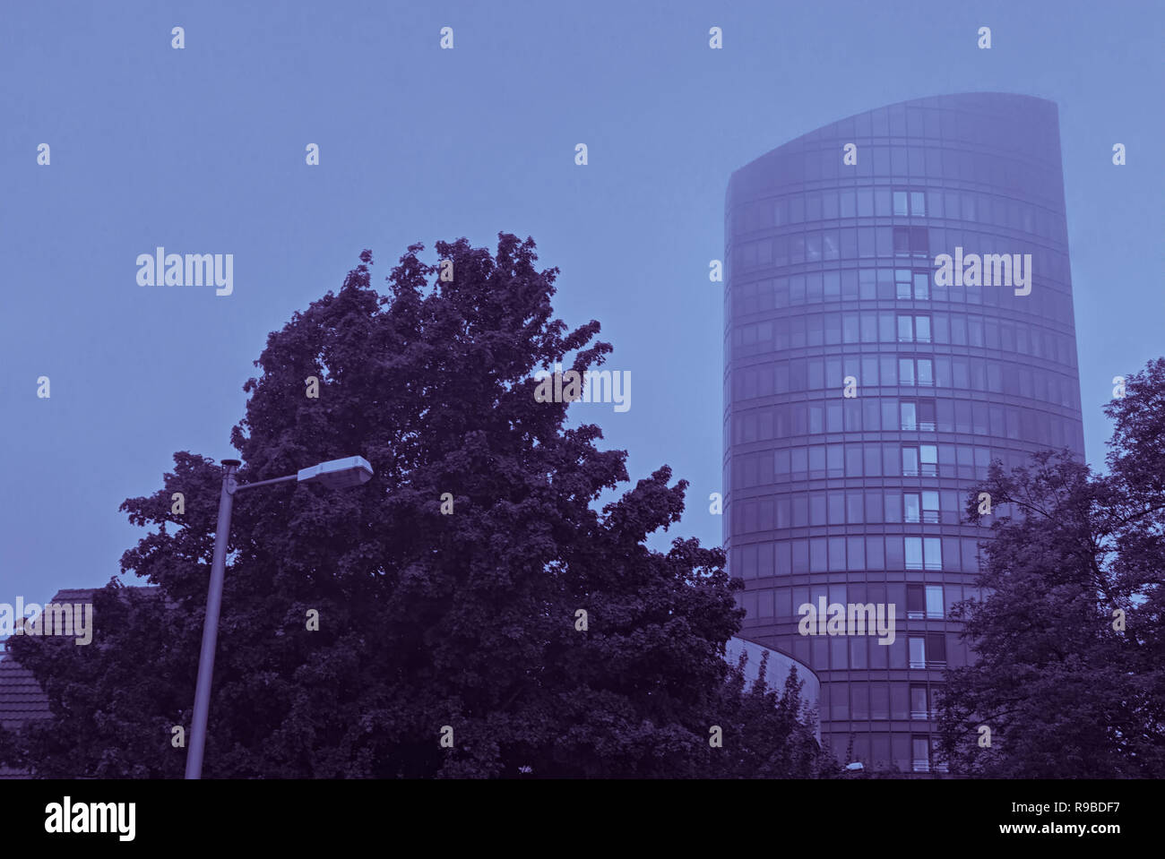 a modern office building on a foggy summer morning Stock Photo - Alamy