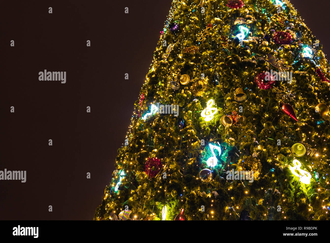 New year tree, decorated with classical toys and illuminated with led ...