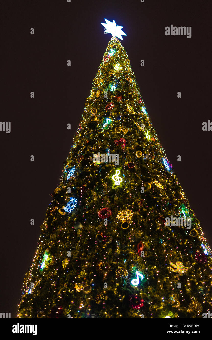 New year tree, decorated with classical toys and illuminated with led ...