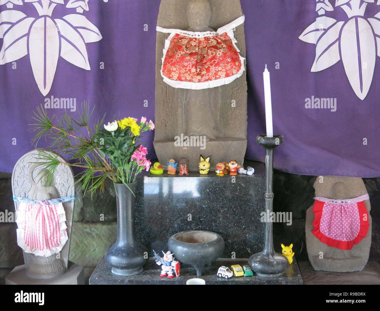 Decorated shrine at the Taya Caves at Kamakura, which were carved into ...