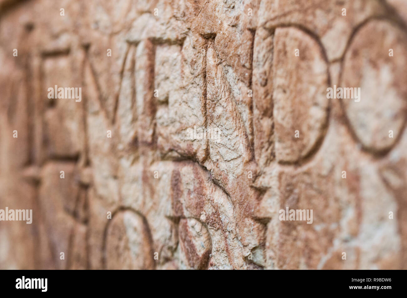 religious engraved letters on stone wall Stock Photo - Alamy