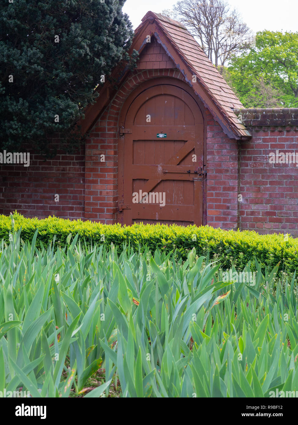 Wooden Gate In A Brick Wall Stock Photo - Alamy