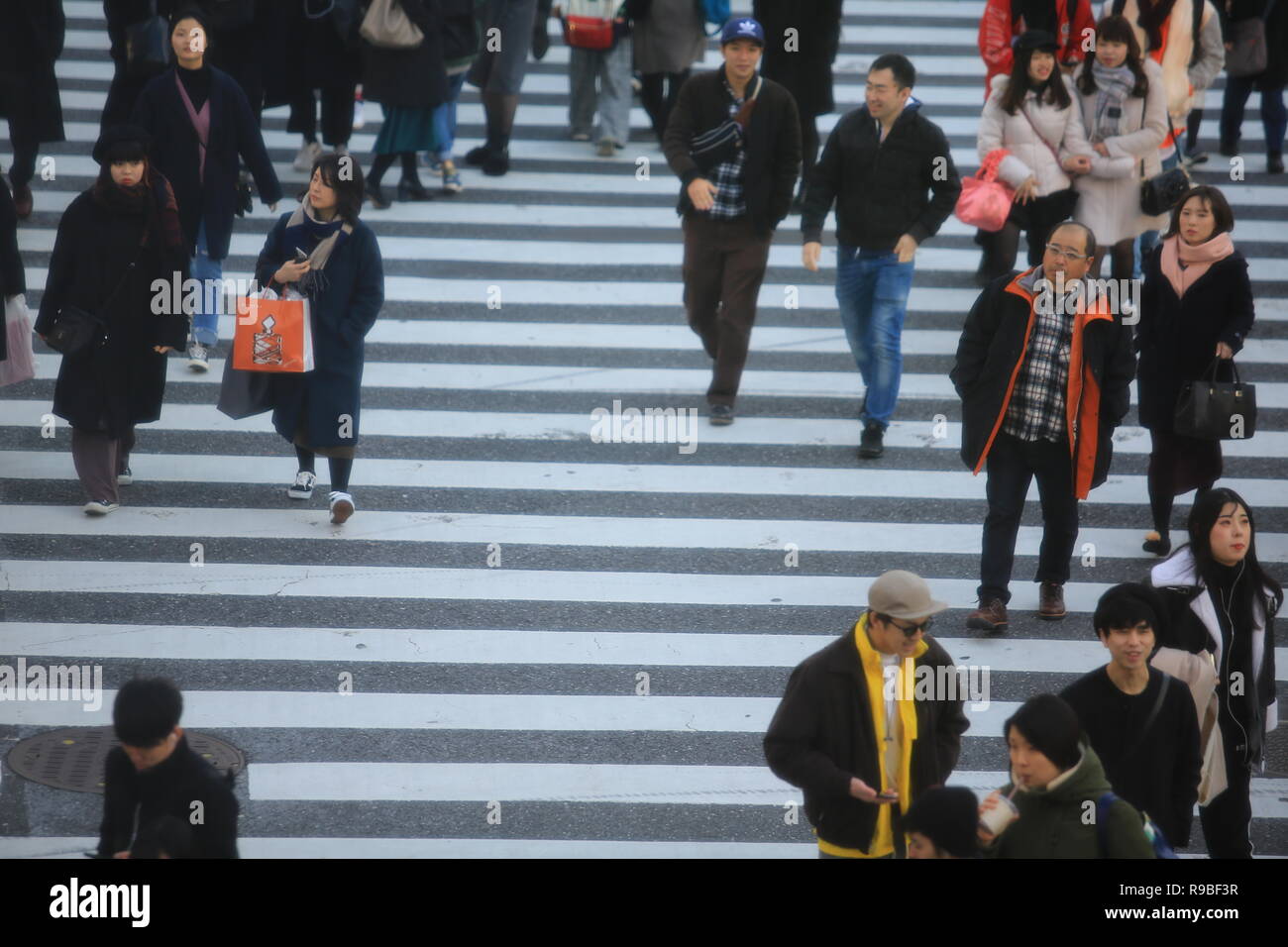 Tokyo/Japan- January 14 2018: japanese cross the road on Shibuya street ...
