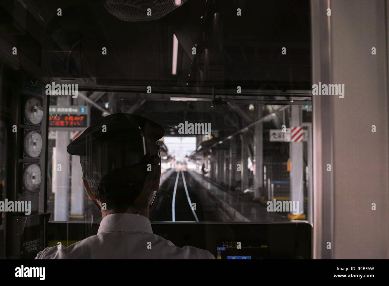 Rear view of a train driver pulling into a station Stock Photo - Alamy