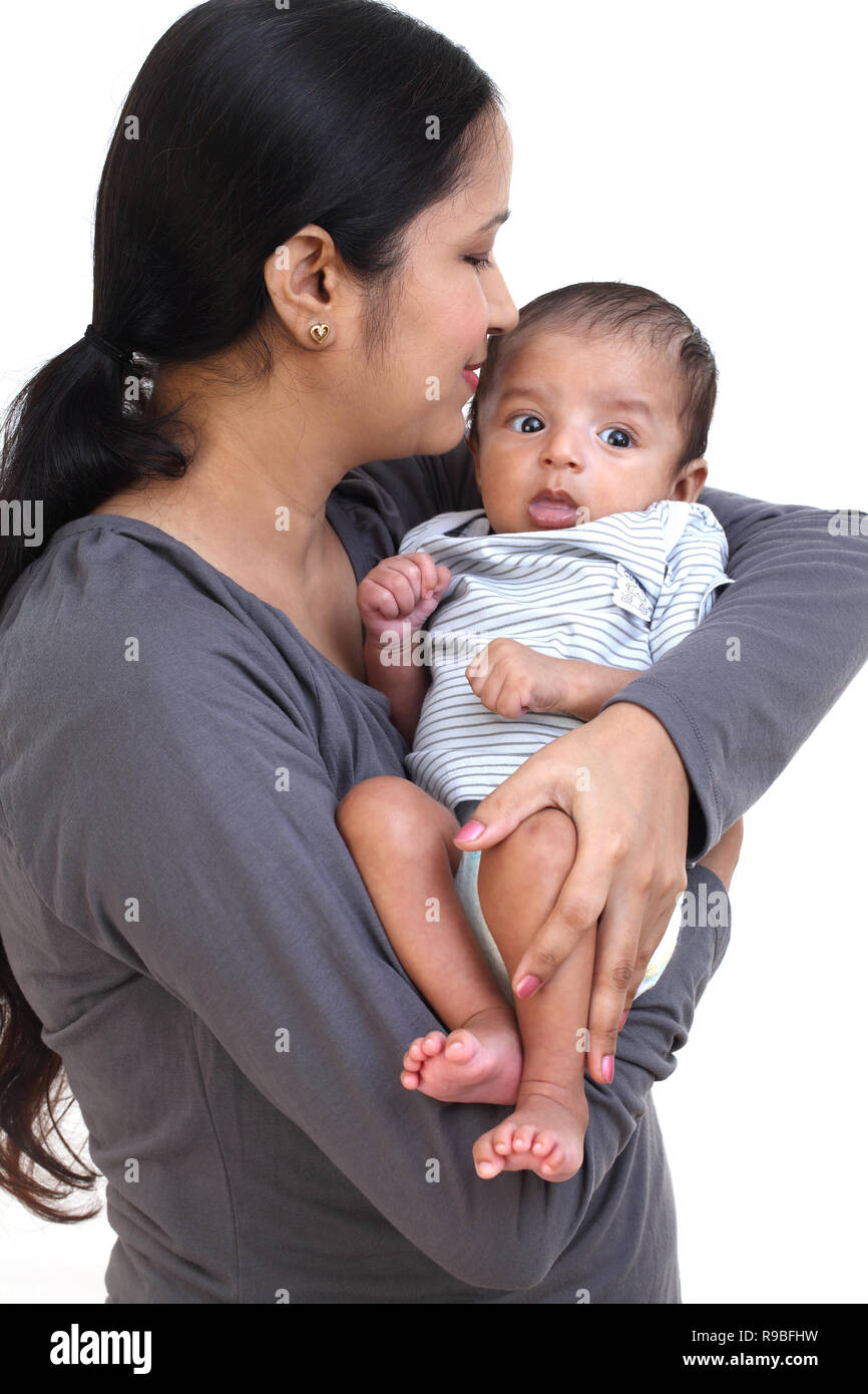 Cheerful mother with newborn baby Stock Photo - Alamy