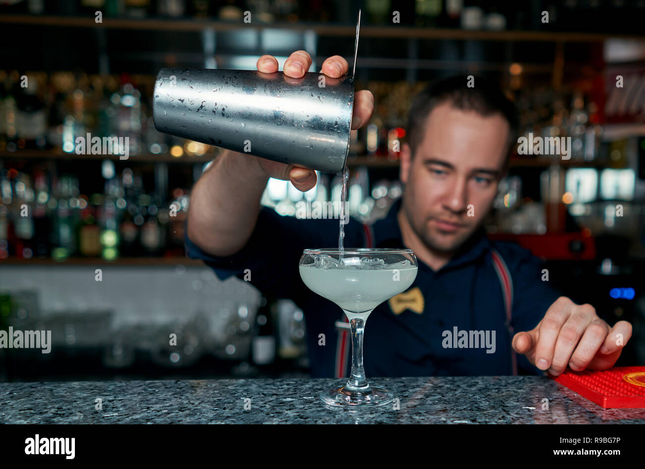 Bartender pouring bottle hi-res stock photography and images - Alamy