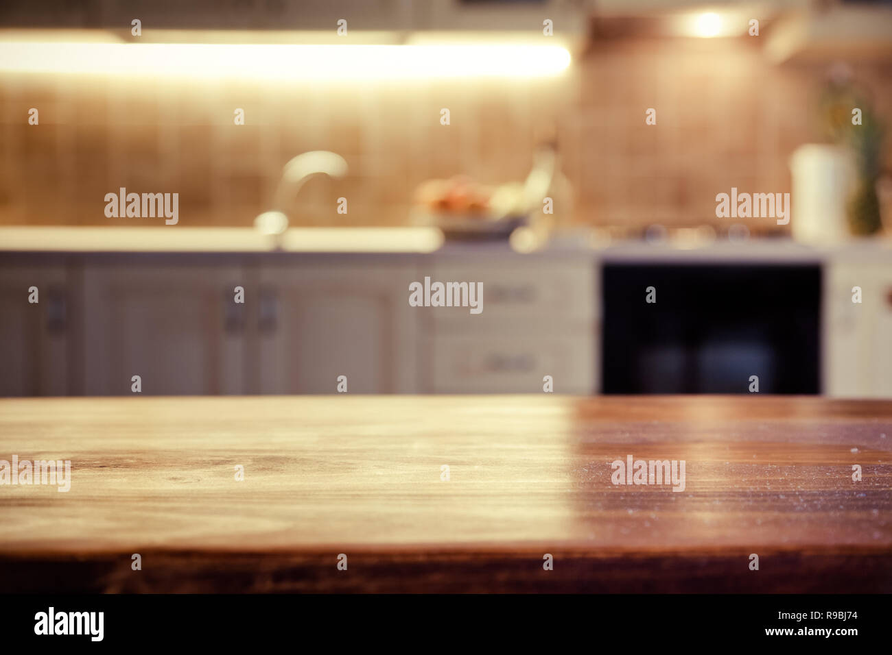blurred kitchen interior and napkin and desk space Stock Photo - Alamy