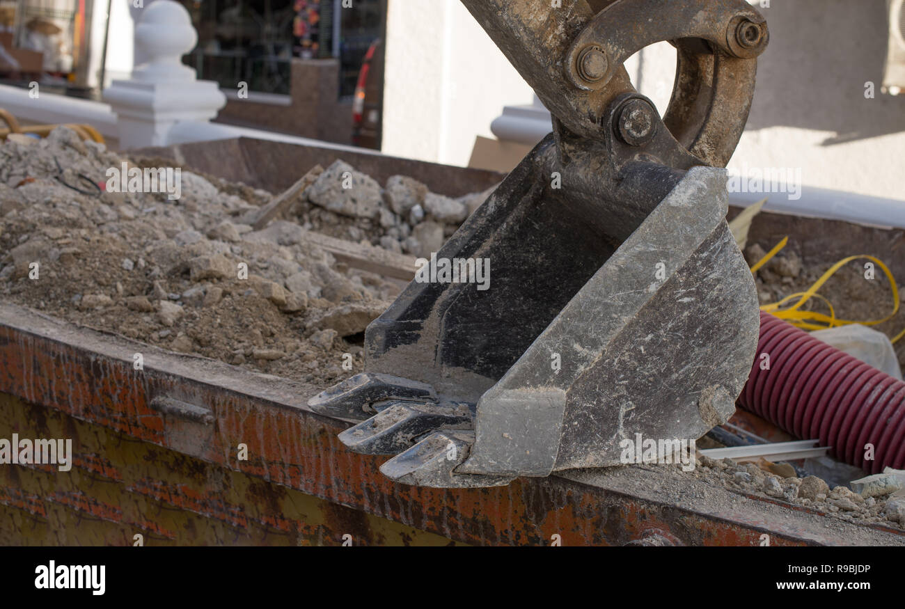 Construction rubble in a large container Stock Photo - Alamy