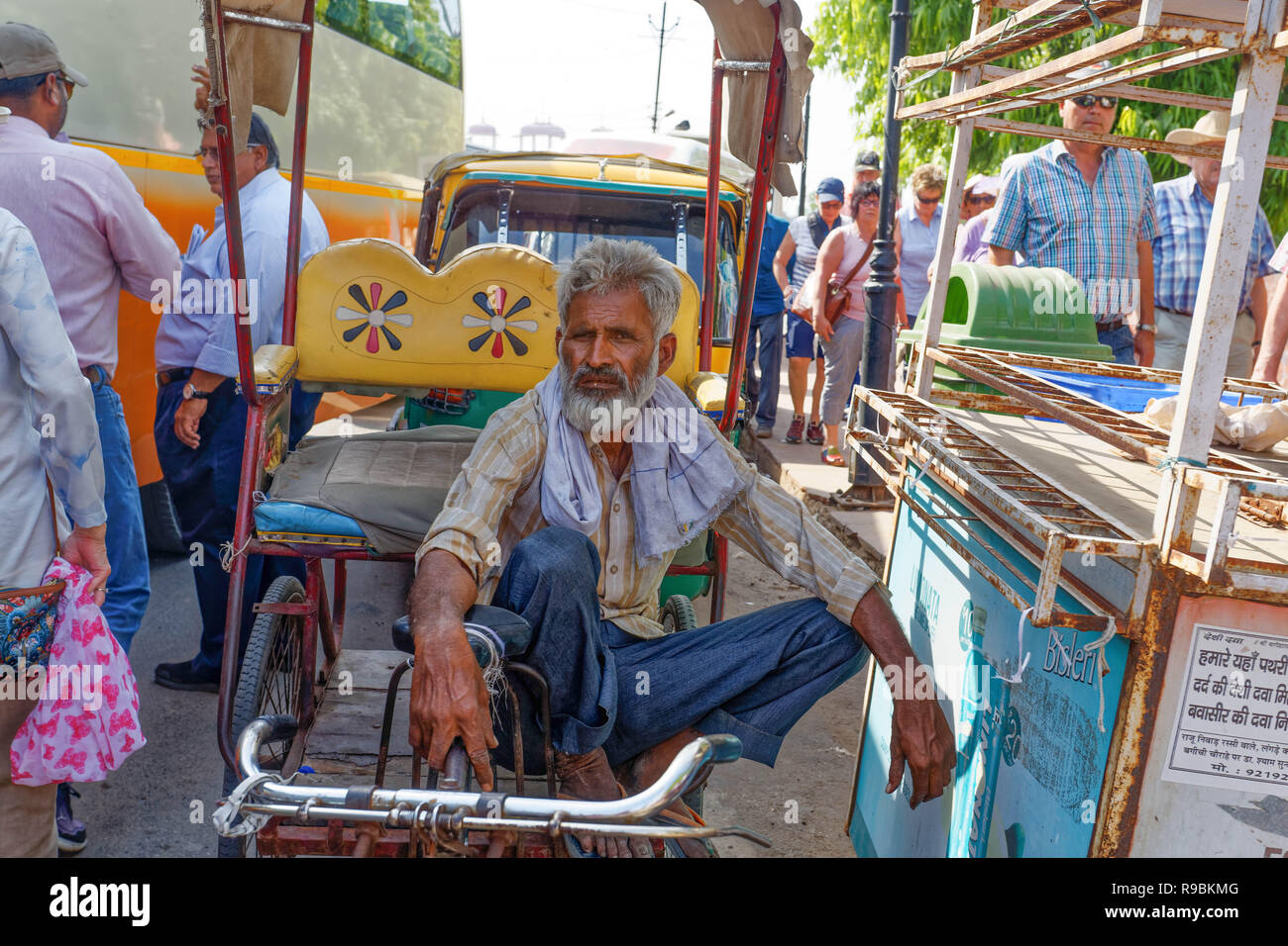 Rickshaw puller sitting hi-res stock photography and images - Alamy