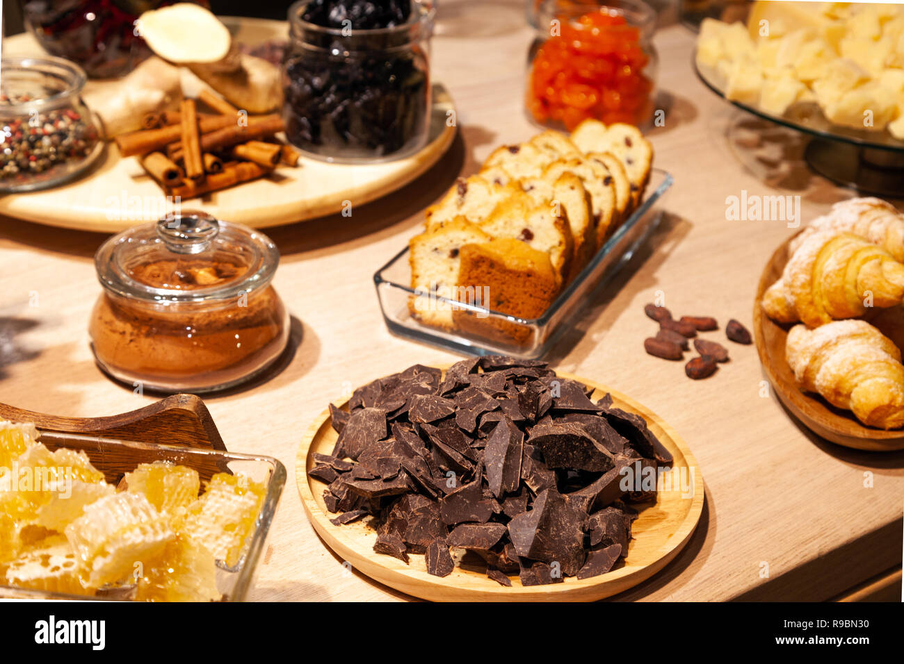 Closeup bakery and snacks, dried fruits, pieces parmesan cheese ...