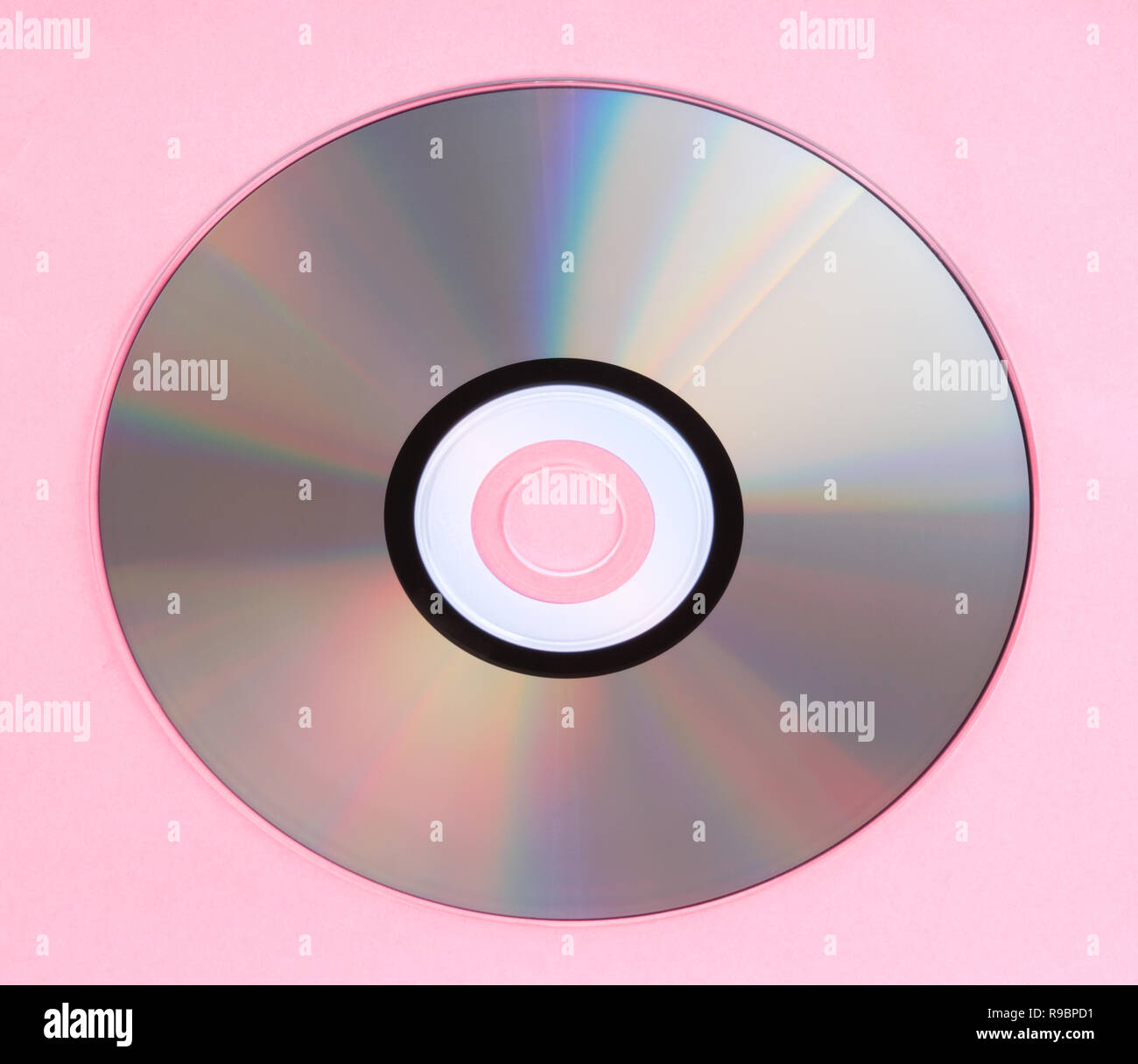 compact disc on pink background Stock Photo - Alamy