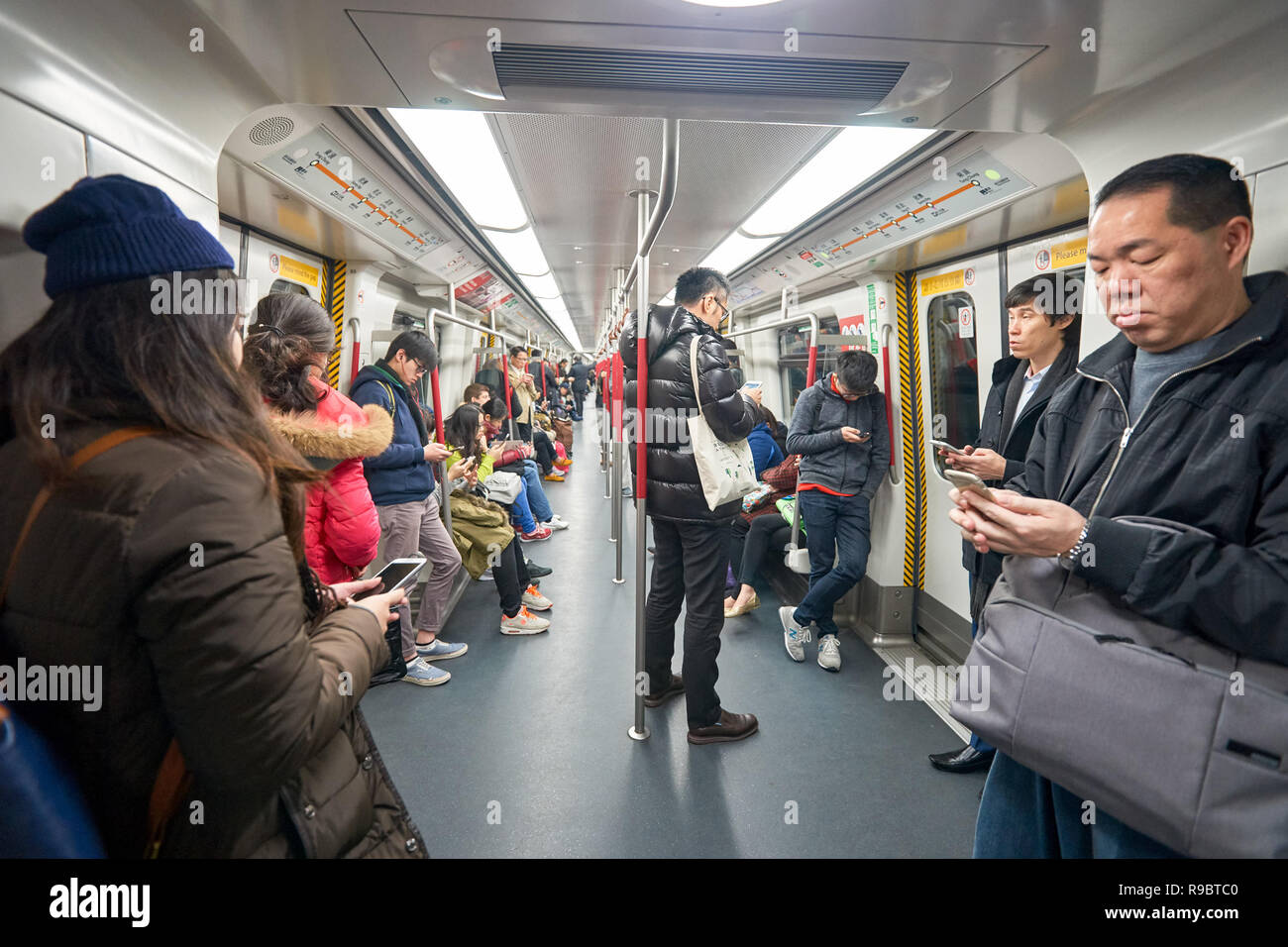HONG KONG - CIRCA JANUARY, 2016: passengers at a MTR train. The Mass ...