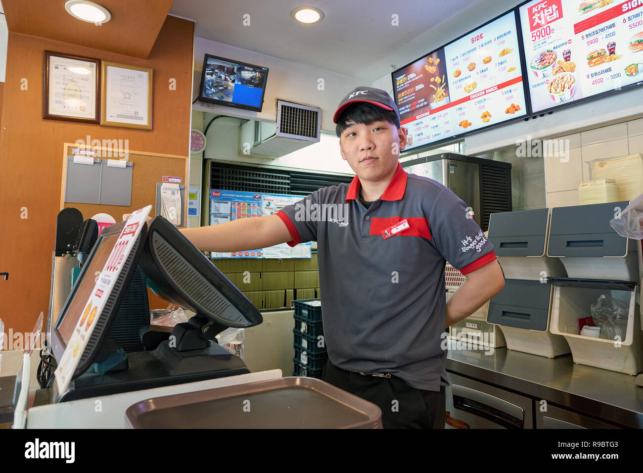 SEOUL, SOUTH KOREA - CIRCA MAY, 2017: indoor portrait of staff at KFC ...