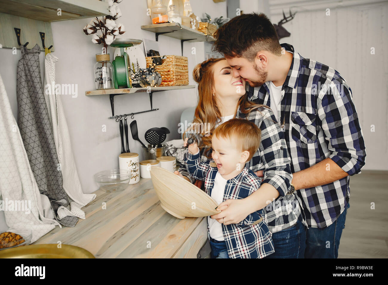 Cute family have fun in the kitchen Stock Photo - Alamy