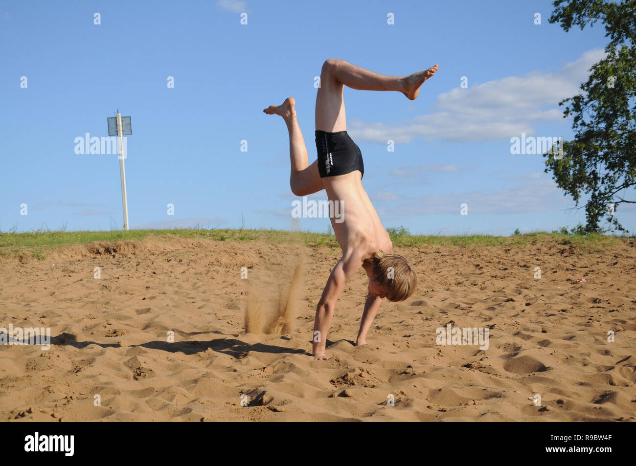 Boy handstand gymnastics hi-res stock photography and images - Alamy