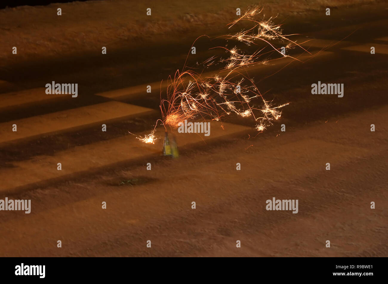 Fireworks explosion on a pedestrian crossing Stock Photo - Alamy